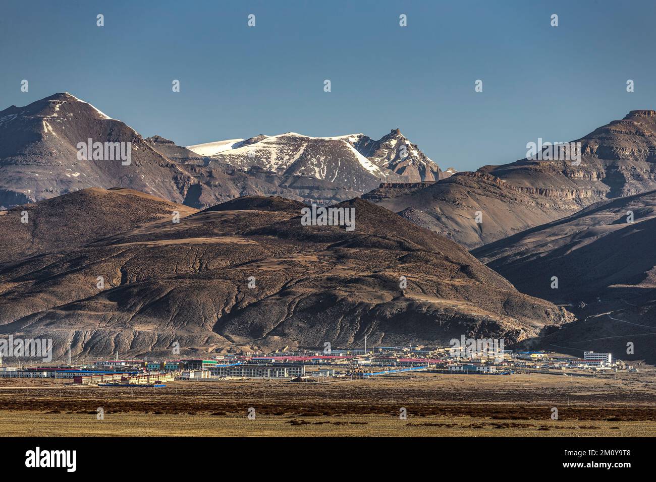 The Taqin County and a mountain with snowy peak in Ali Prefecture ...
