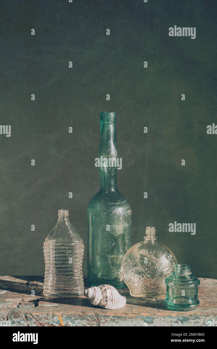 Still Life with differently shaped glass bottles. High quality photo ...