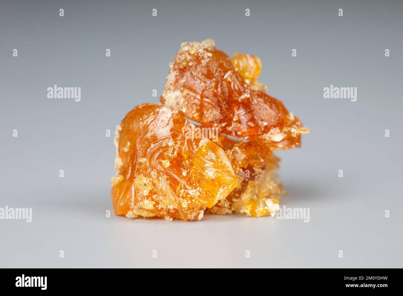 a pieces of cannabis wax clsoeup. concentrate dab stone with high thc ...