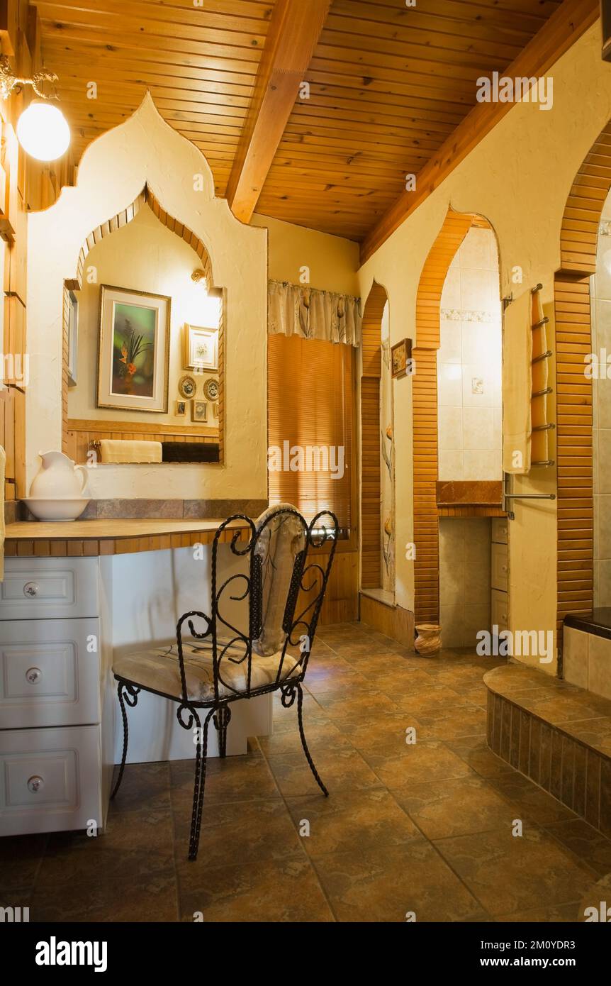 Dressing table counter and chair in spacious bathroom and powder room ...