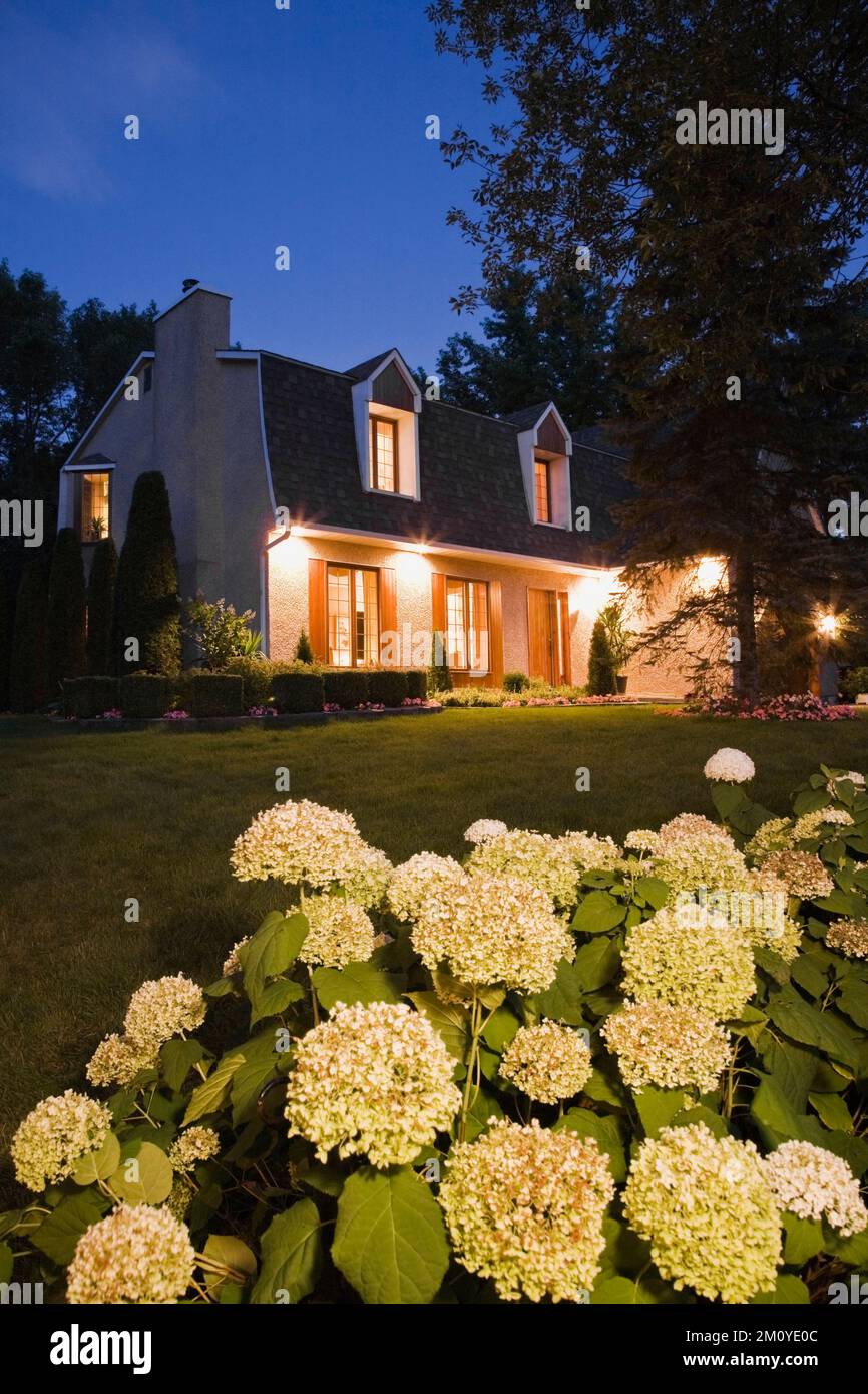 Modern two storied stucco cladded Canadiana style home with landscaped ...