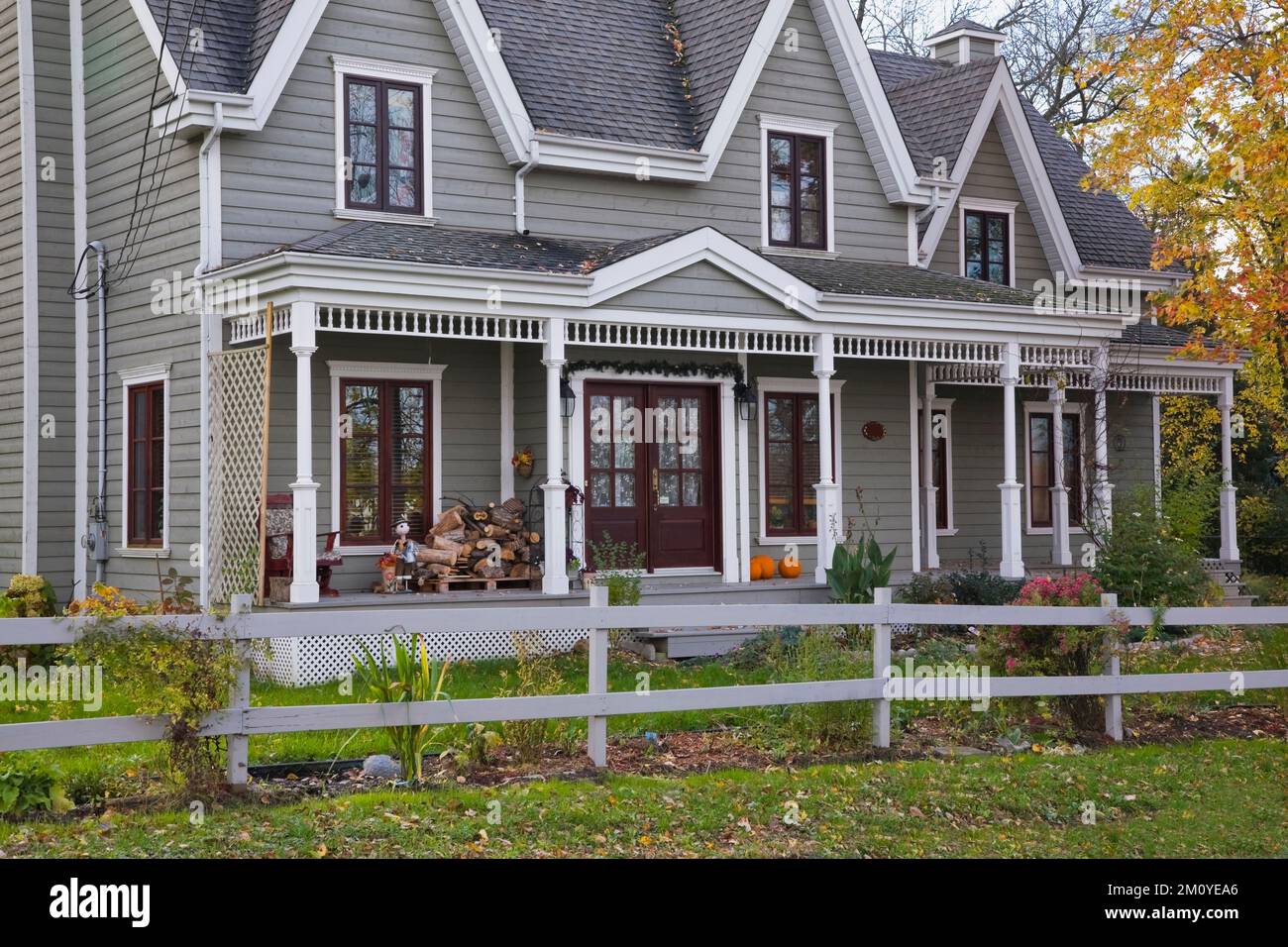 Grey clapboard and white trim two story Victorian country style home ...