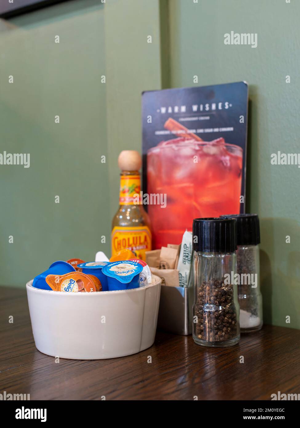 Restaurant breakfast condiments, salt and pepper, creamer, hot sauce ...