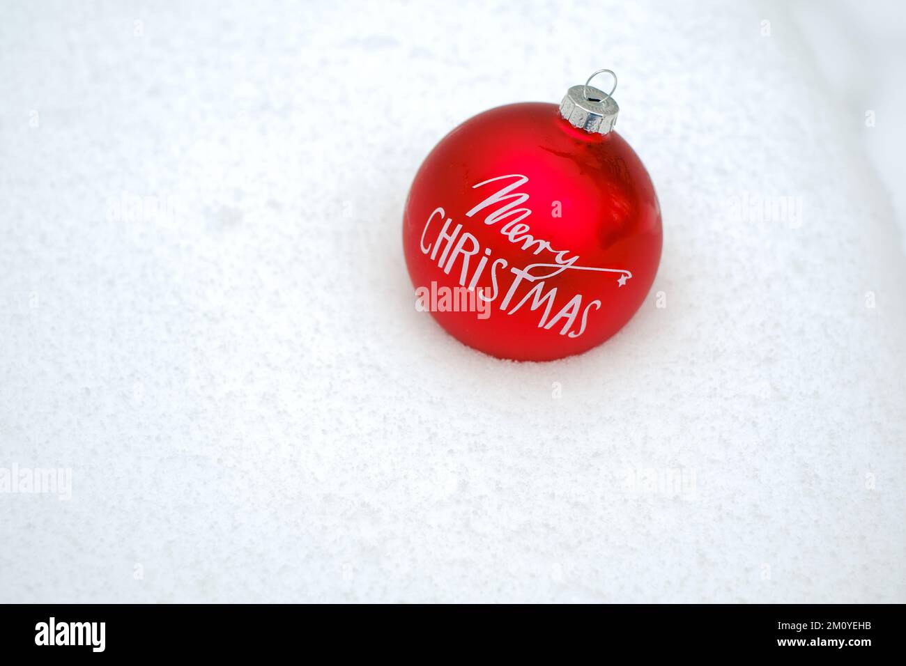 Merry Christmas background.Red Christmas ball snow in a winter snowy ...