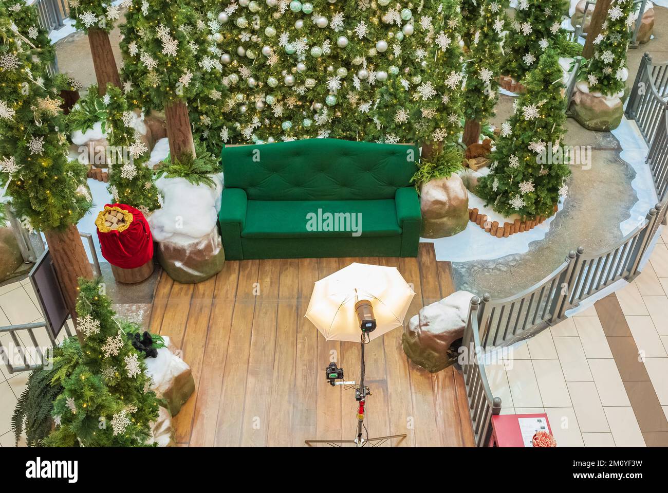 Christmas photo zone. Sofa and Christmas tree, balls, garlands, New ...