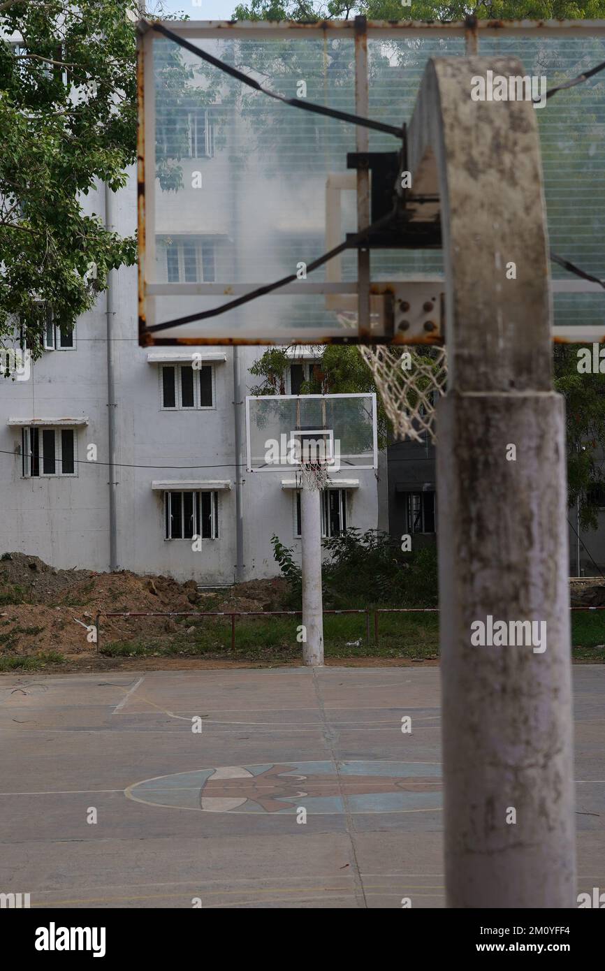 old vintage stone building with basket ball court Stock Photo - Alamy