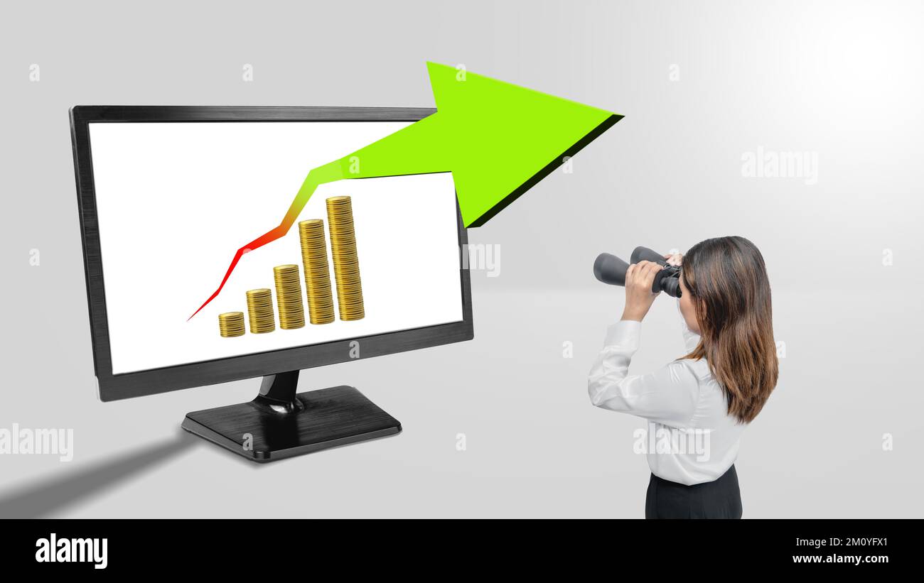Asian businesswomen with binoculars looking at increasing graphs on the ...