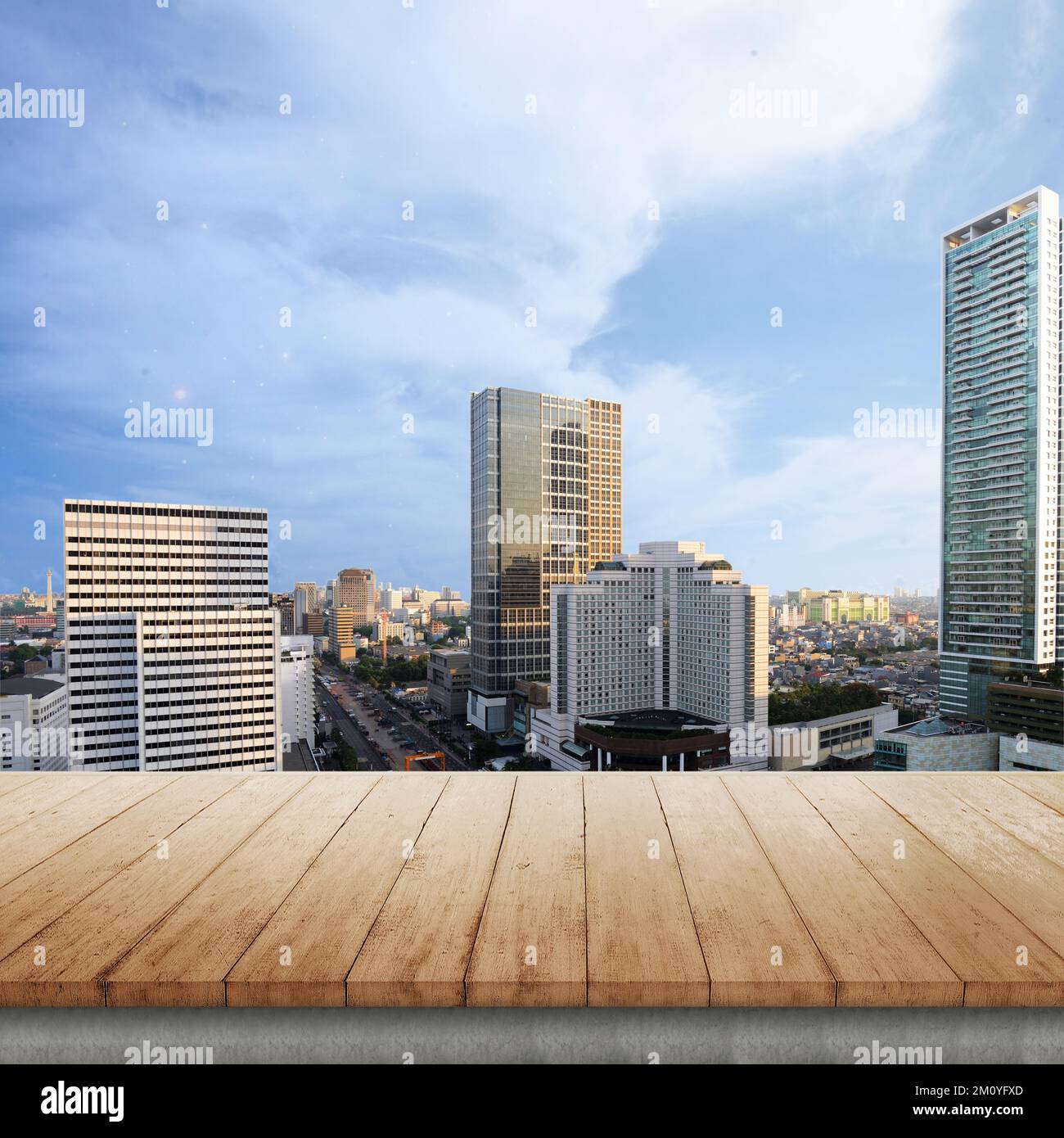 Wooden floors with skyscrapers and modern buildings with the blue sky ...