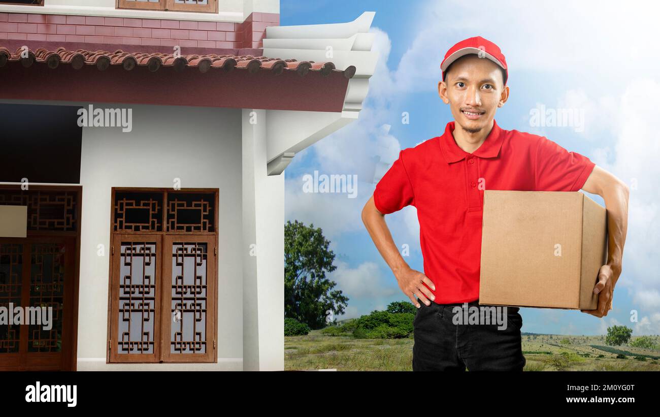 Parcel delivery man with a hat carrying a package to the house Stock ...