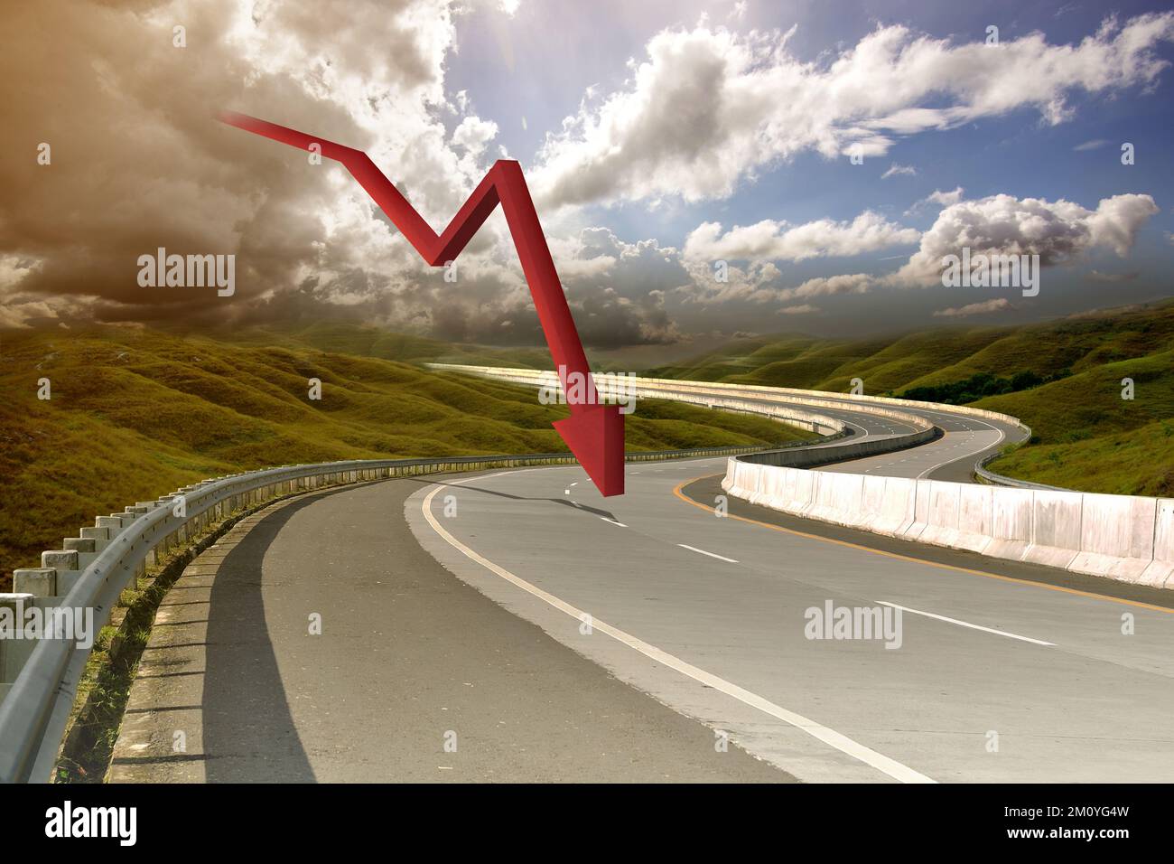 Decreased arrow on the street with sky background Stock Photo - Alamy