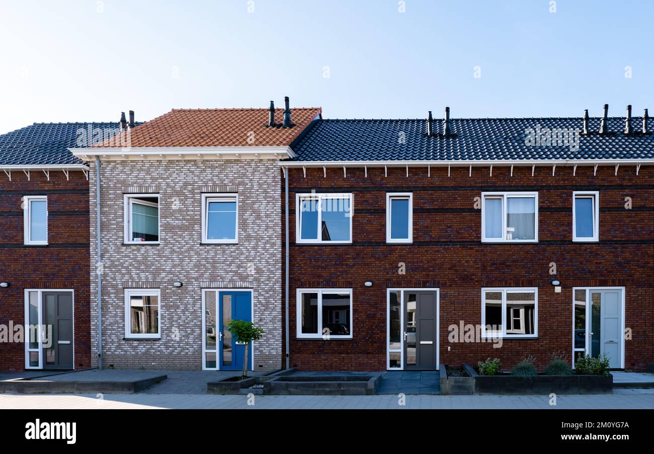 a row of newly build modern family homes in the Netherlands, dutch ...