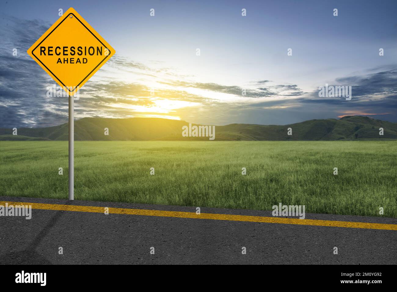 Street with recession sign with sunset sky background Stock Photo - Alamy