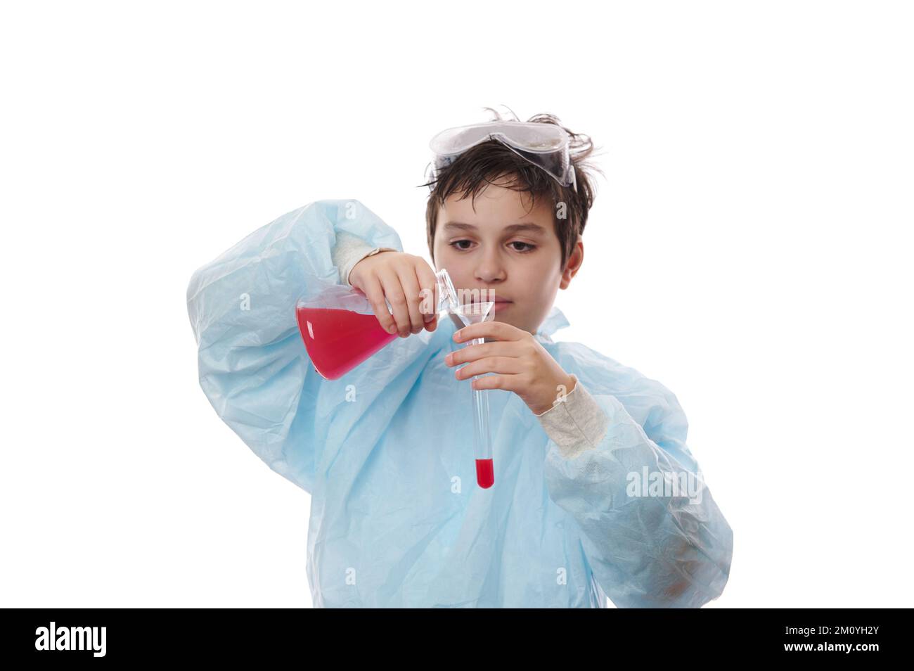 Caucasian teenage boy - young chemist scientist in workwear, doing ...
