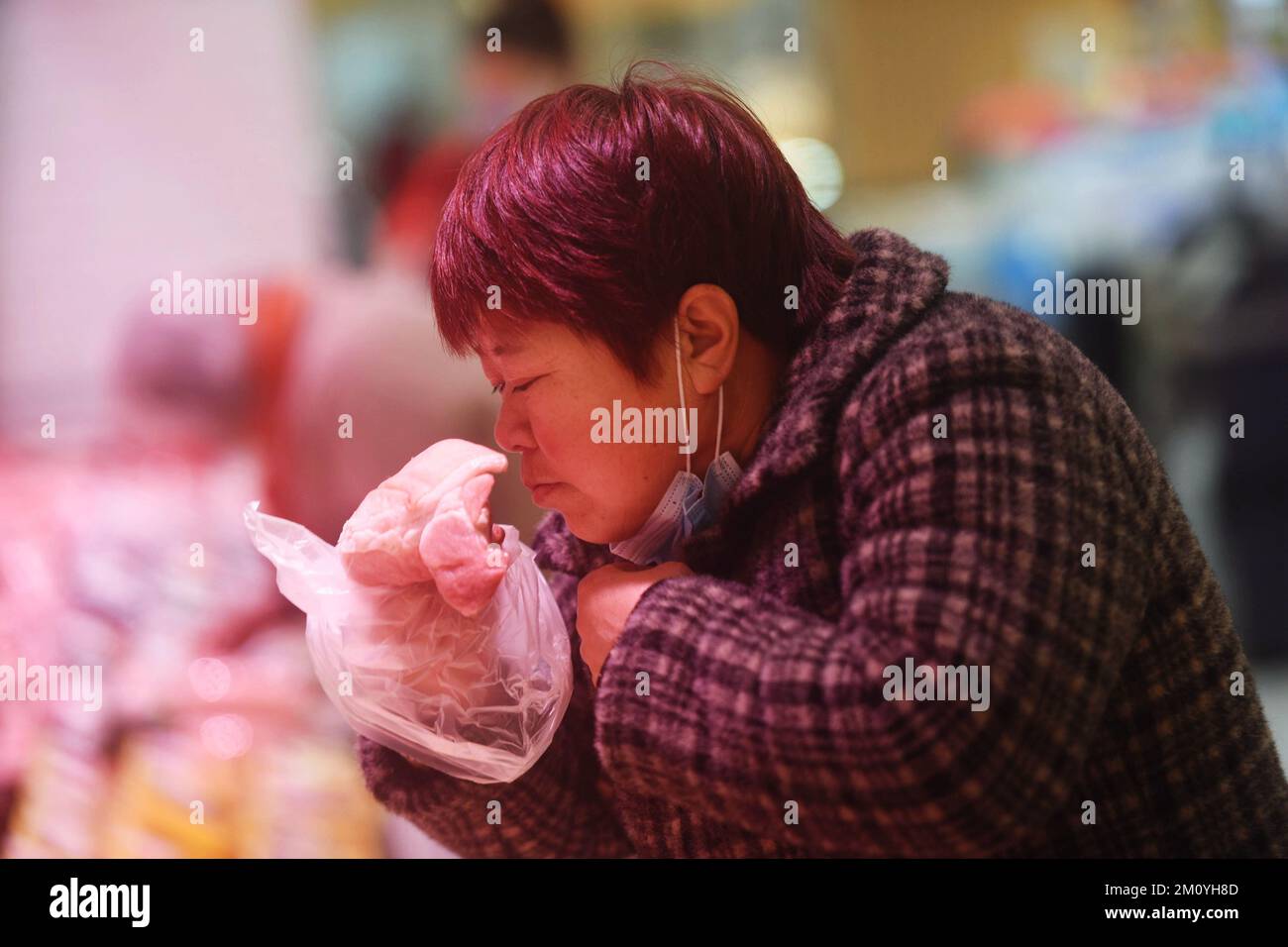 Customers shop at a supermarket in Hangzhou, Zhejiang province, China ...