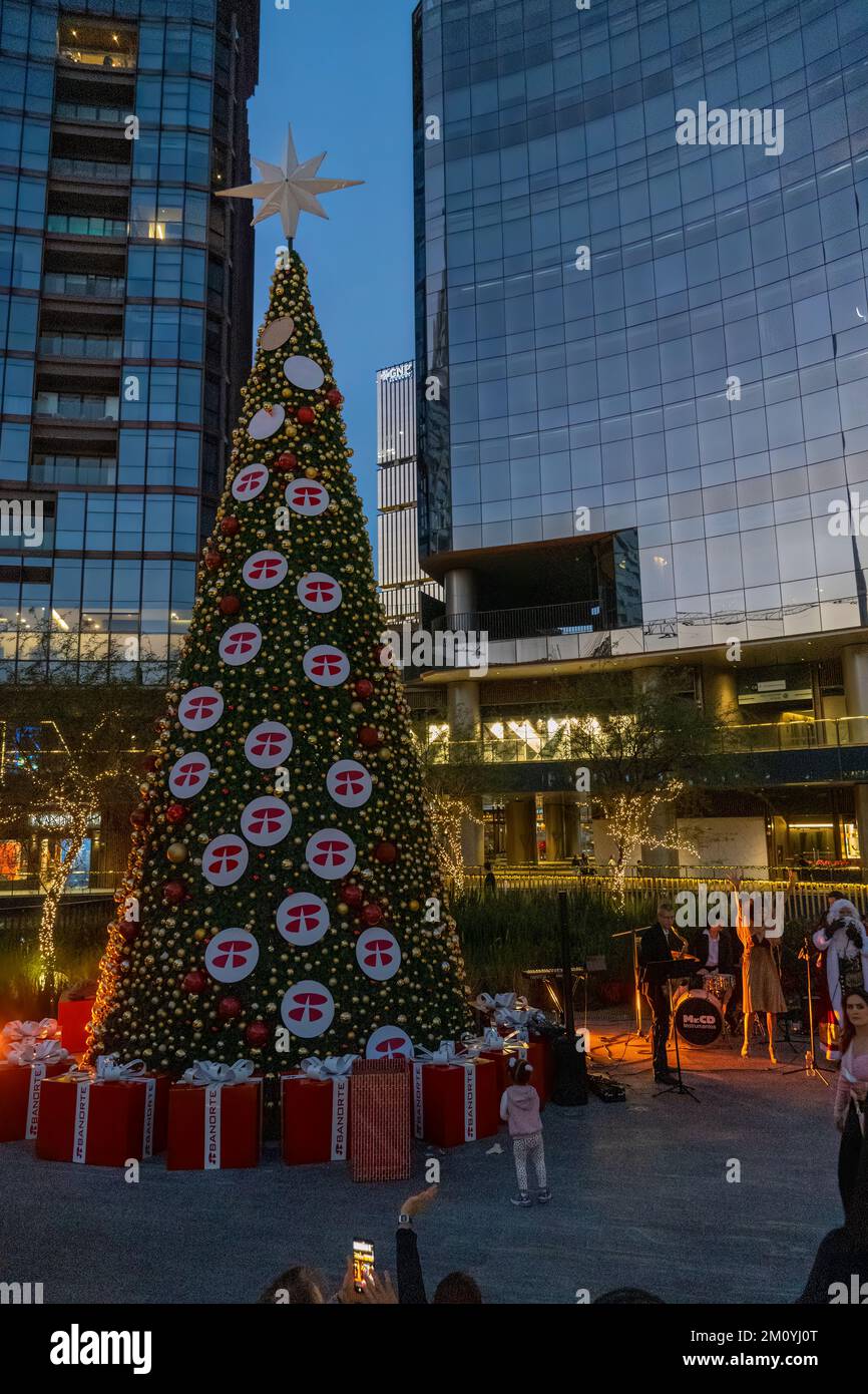 Merry Christmas and Happy people are celebrating holiday in modern ...