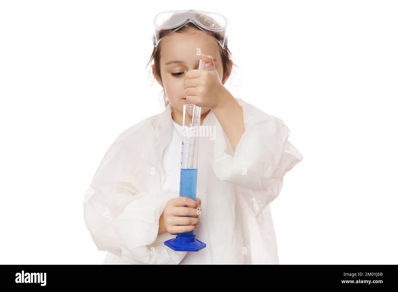 Hands of little chemist drips few reagents into chemical solution in ...