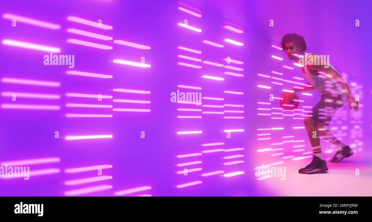 Composite of biracial basketball player dribbling by illuminated lights ...