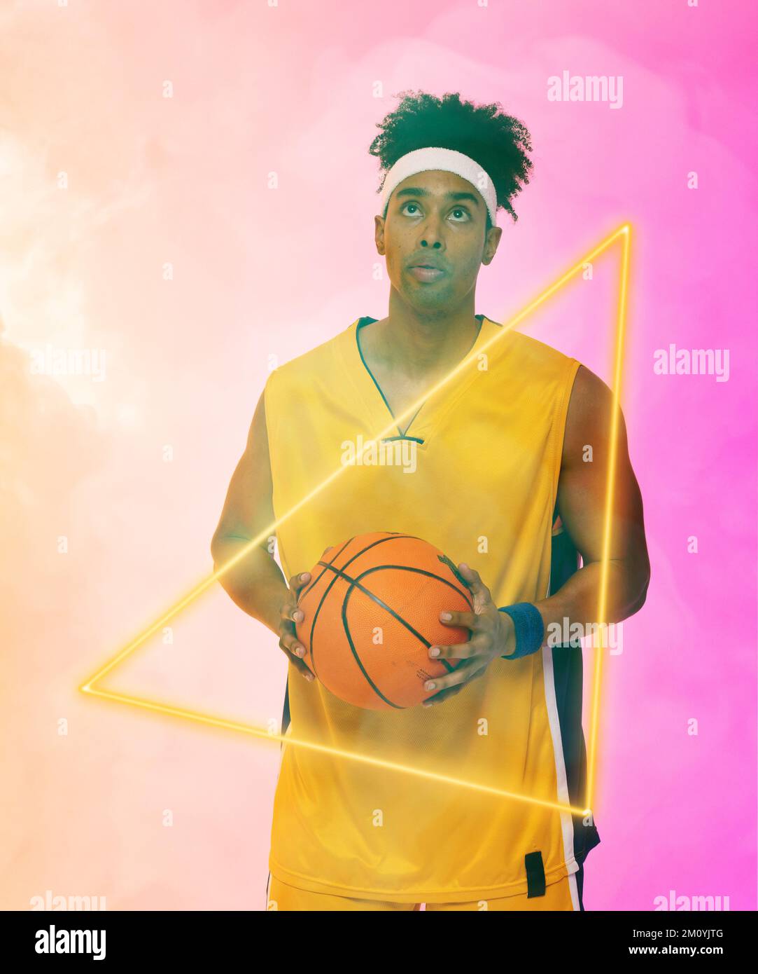 Composite of biracial male basketball player with ball standing by ...