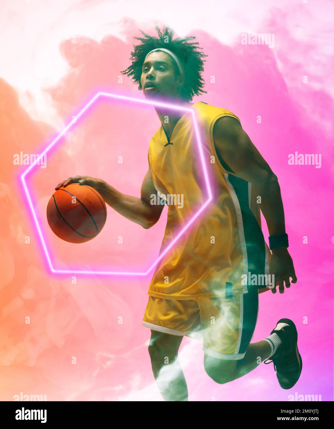 Biracial male player running and dribbling basketball by hexagon over ...