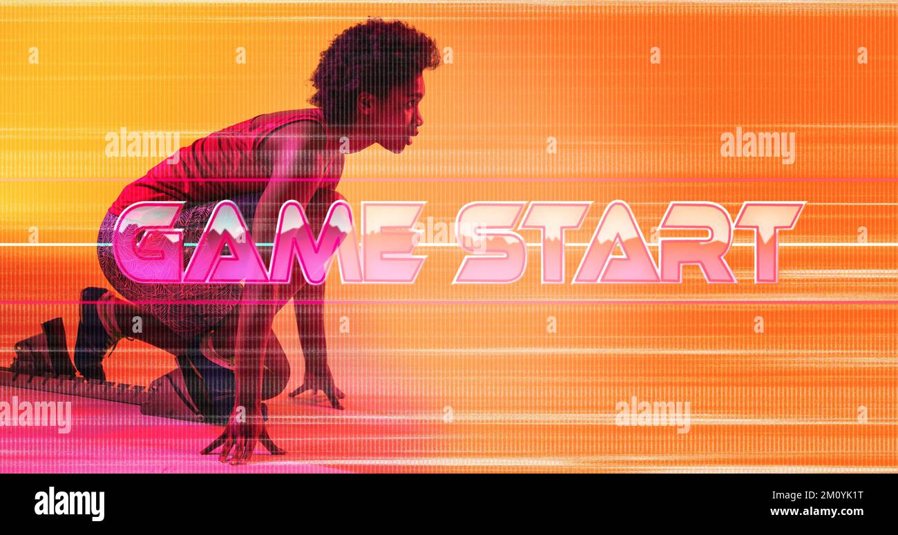 Side view of biracial female athlete at starting position by game start ...