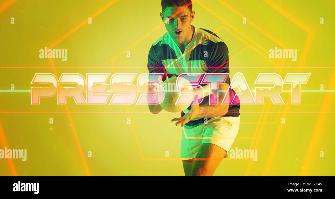 Glowing press start and lines over caucasian male player catching rugby ...