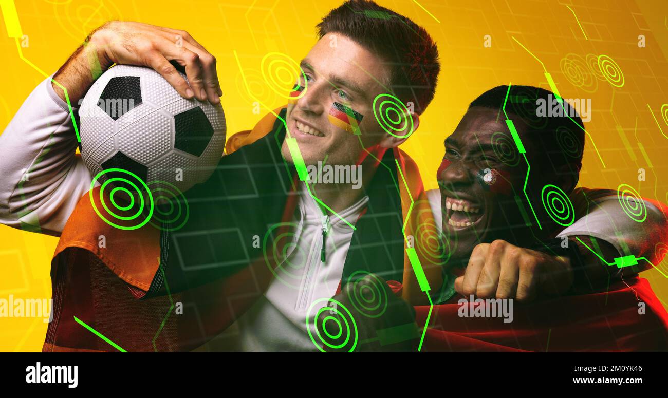 Illuminated circles and plants over cheerful diverse male fans with ...