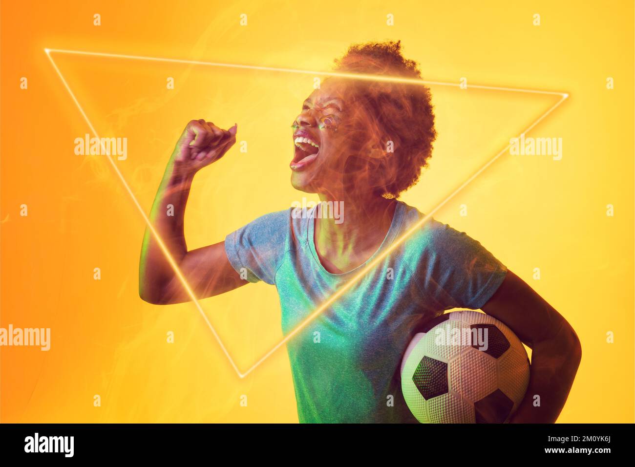 Triangle neon over african american female fan with flag celebrating ...