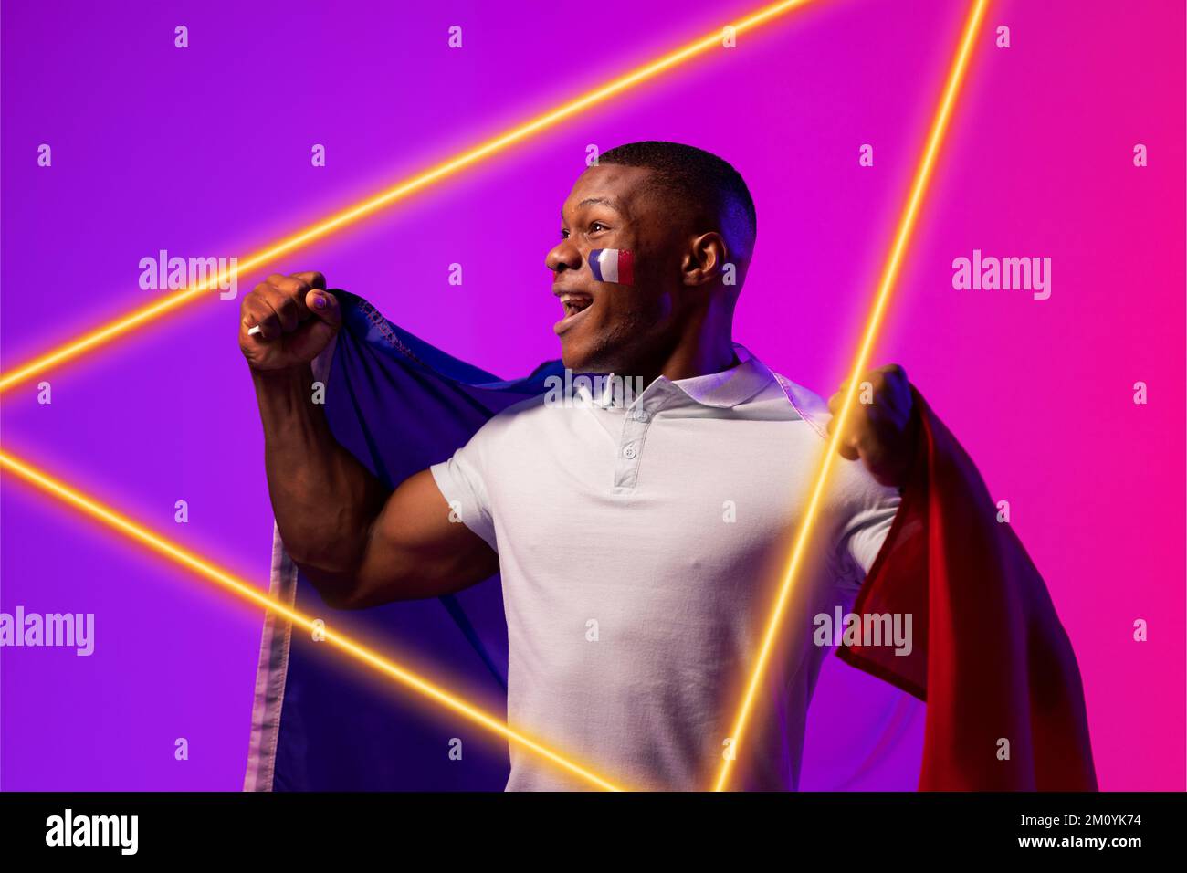 Triangle neon over african american young male fan cheering with france ...