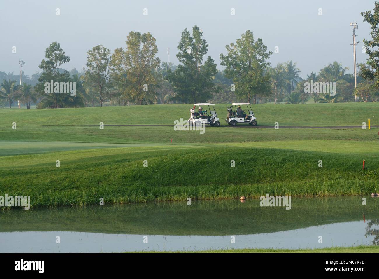 CHIANG MAI, THAILAND - February 4, 2022 : The golfer driving golf car ...