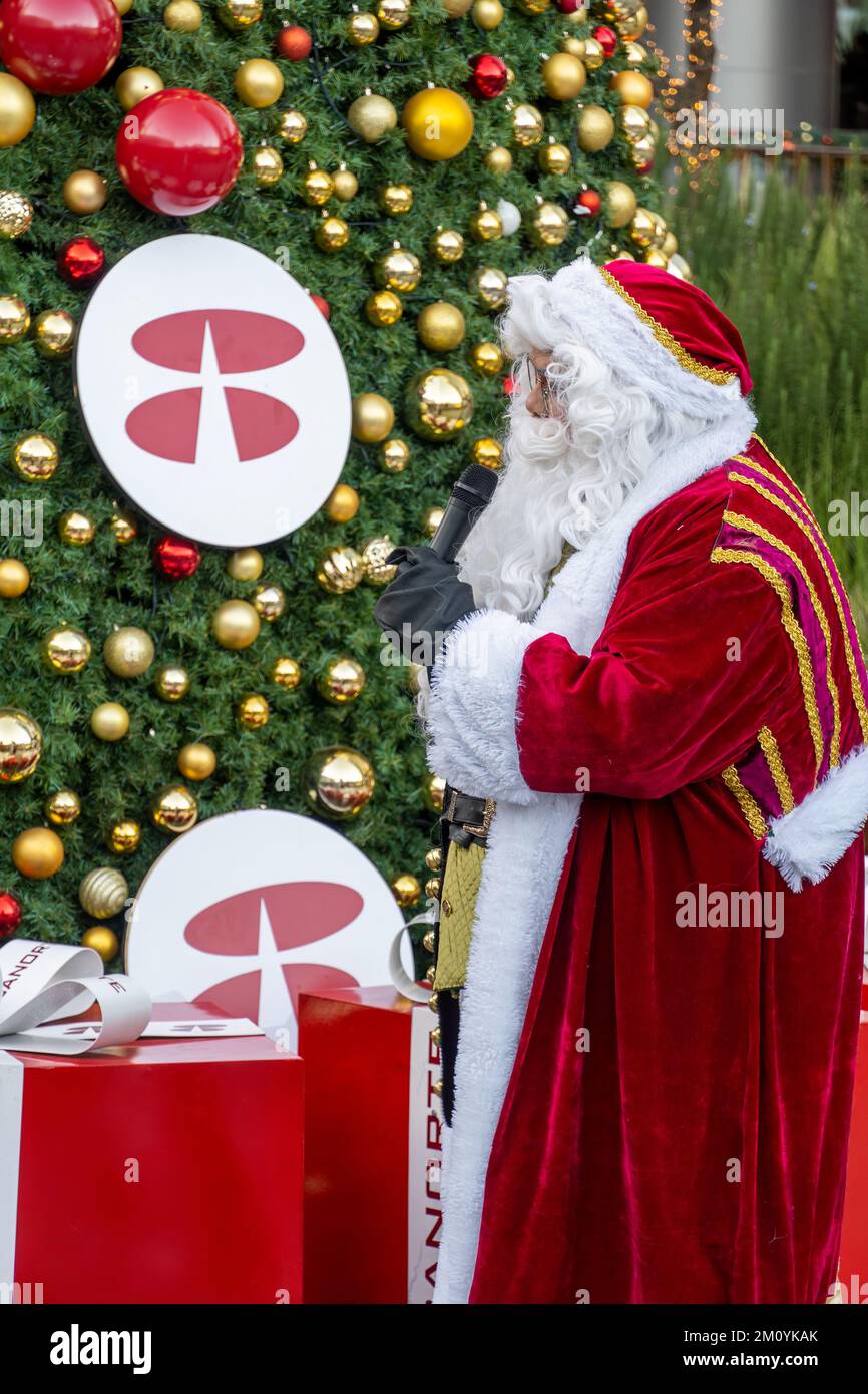 Santa behind the tree hi-res stock photography and images - Alamy