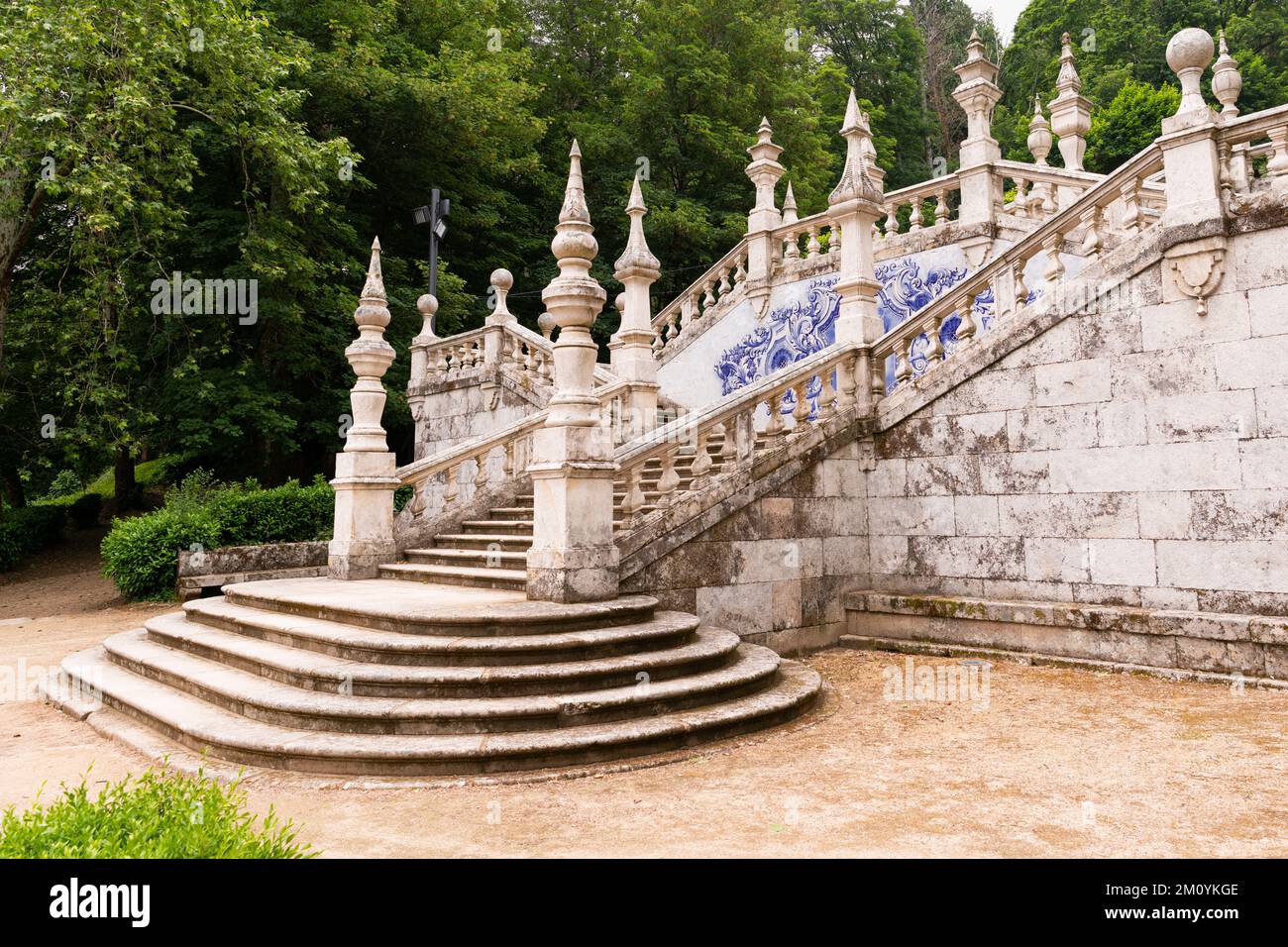 Steps lined with ornate white balustrades and blue tile at the ...