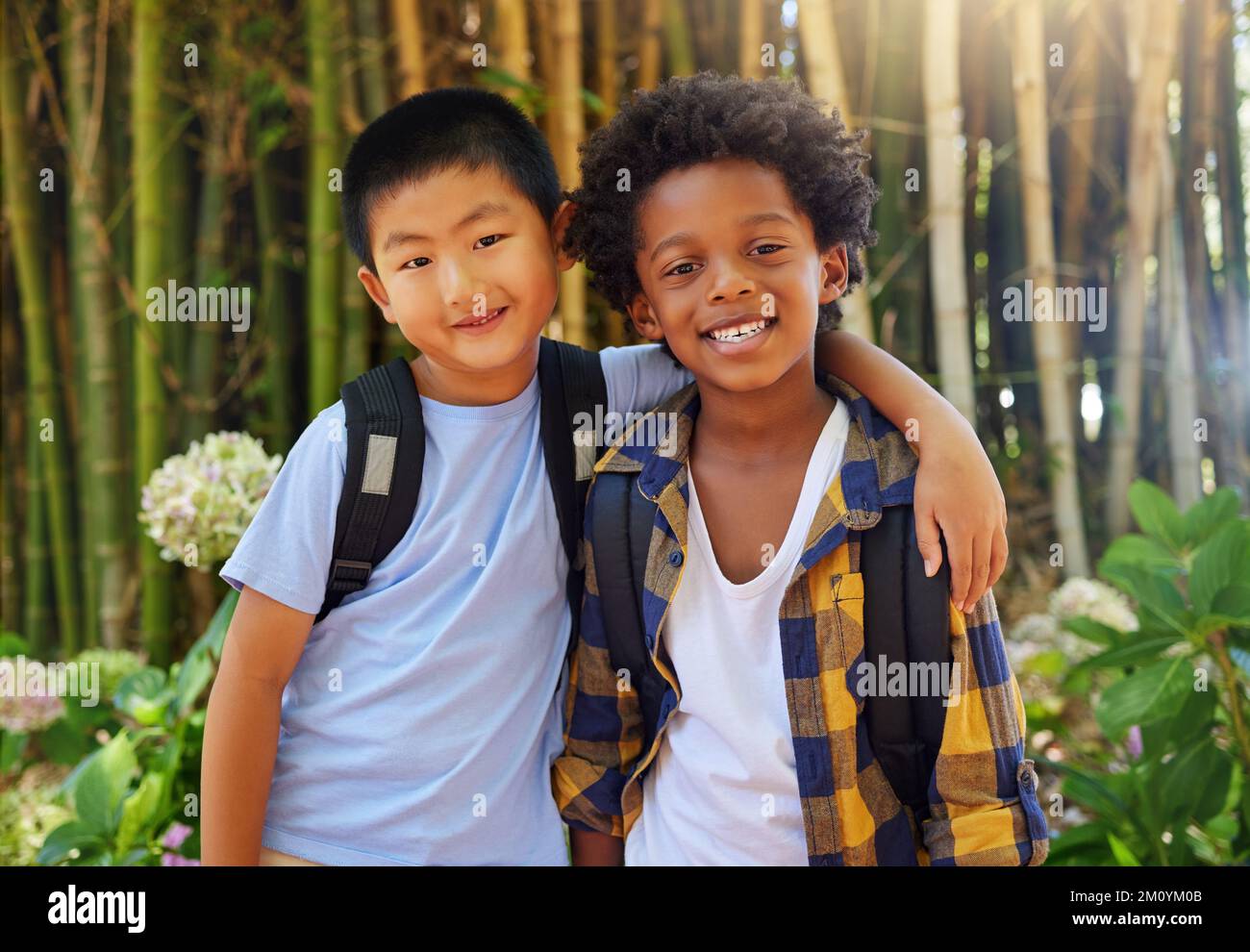 Being a kid is all about having fun. two little boys exploring outside ...