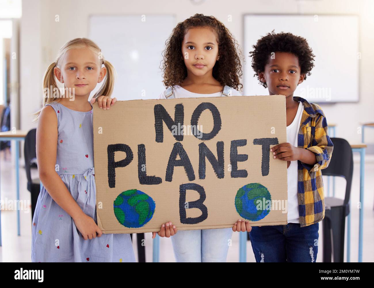 Preschool is fun. a group of children holding a sign in the classroom ...