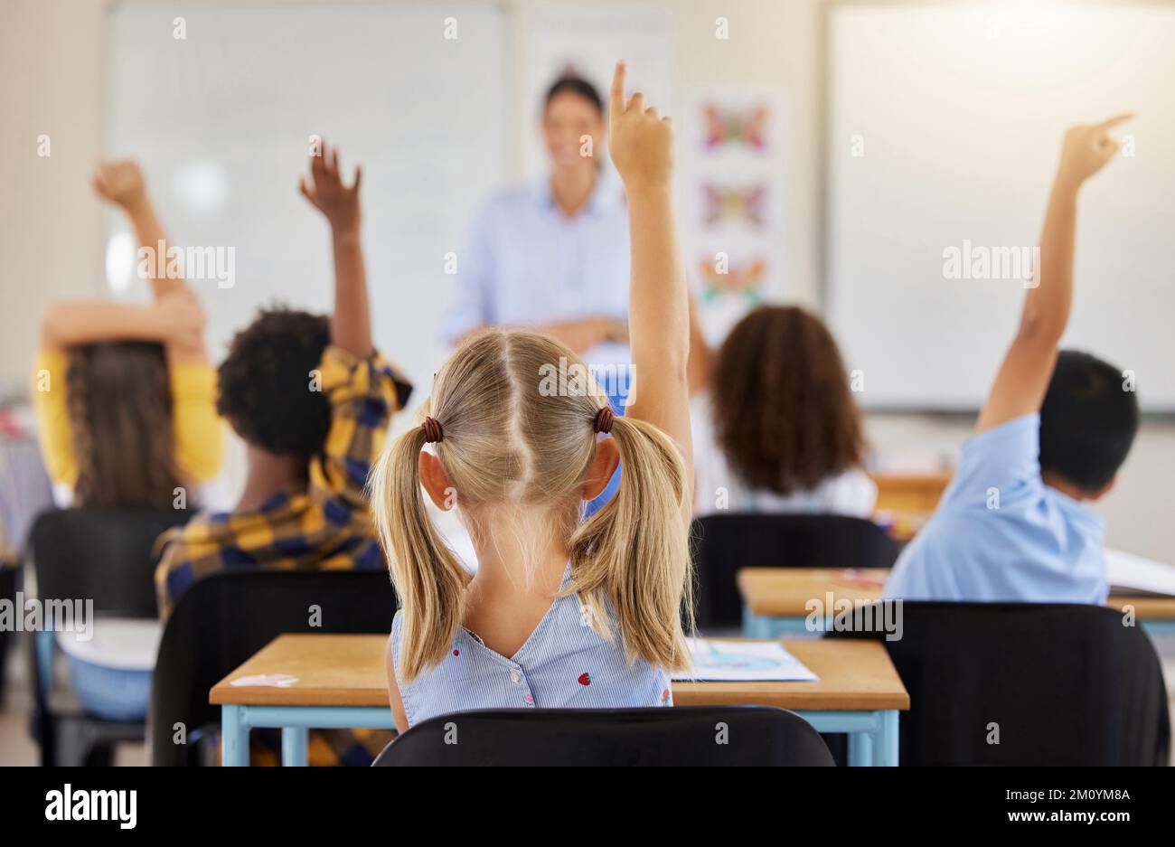 Children gain a lot from going to school. a young woman teaching a ...