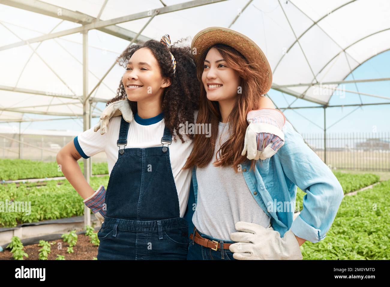 Maintaining their farms long-term sustainability. two young women ...