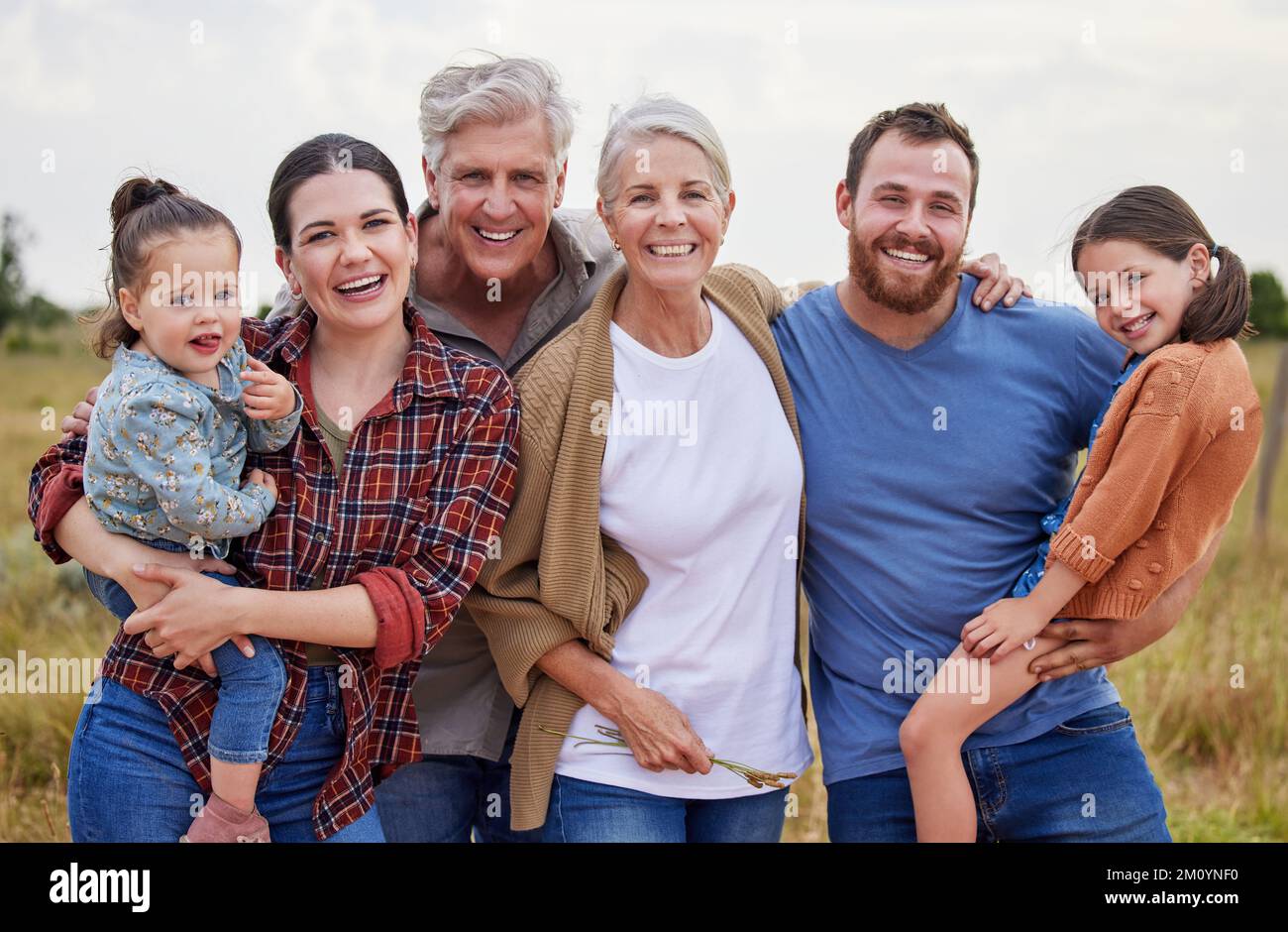 Life is centered around family. a multi-generational family standing ...