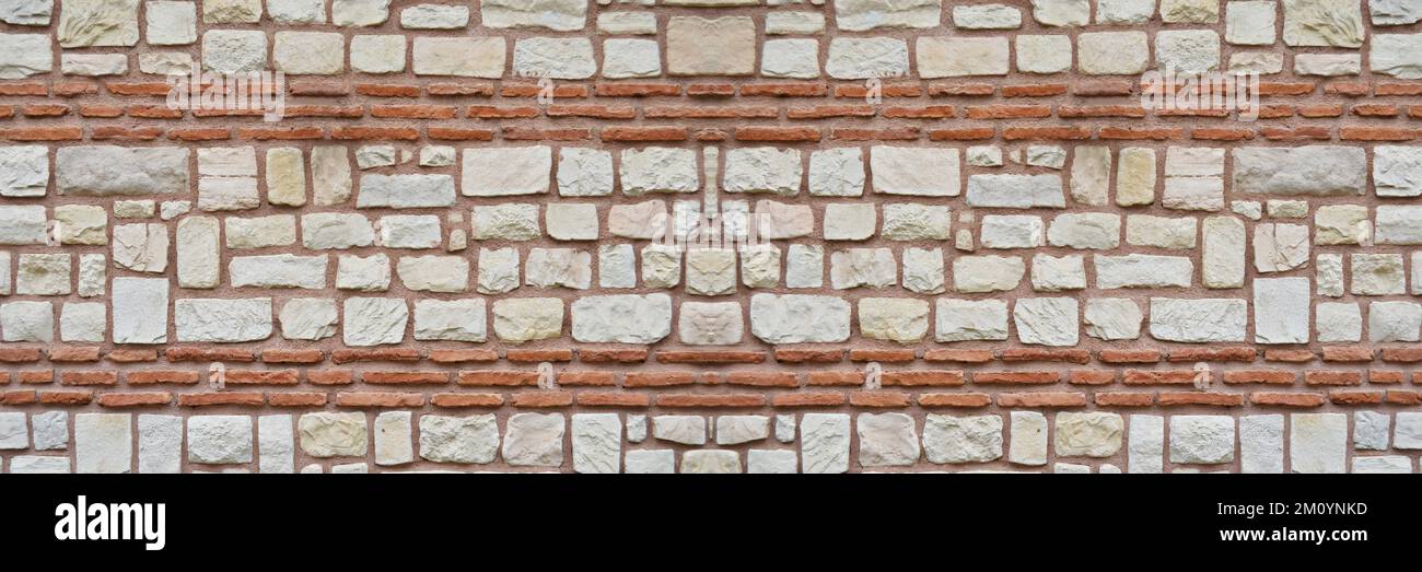 Sturdy yellow and beige cut stone brick wall, good for backgrounds ...