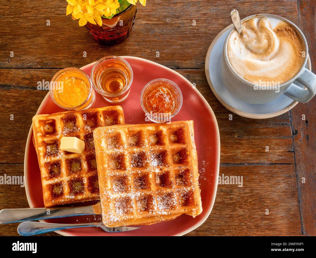 Overhead view of a delicious sweet breakfast of Belgian waffles and ...