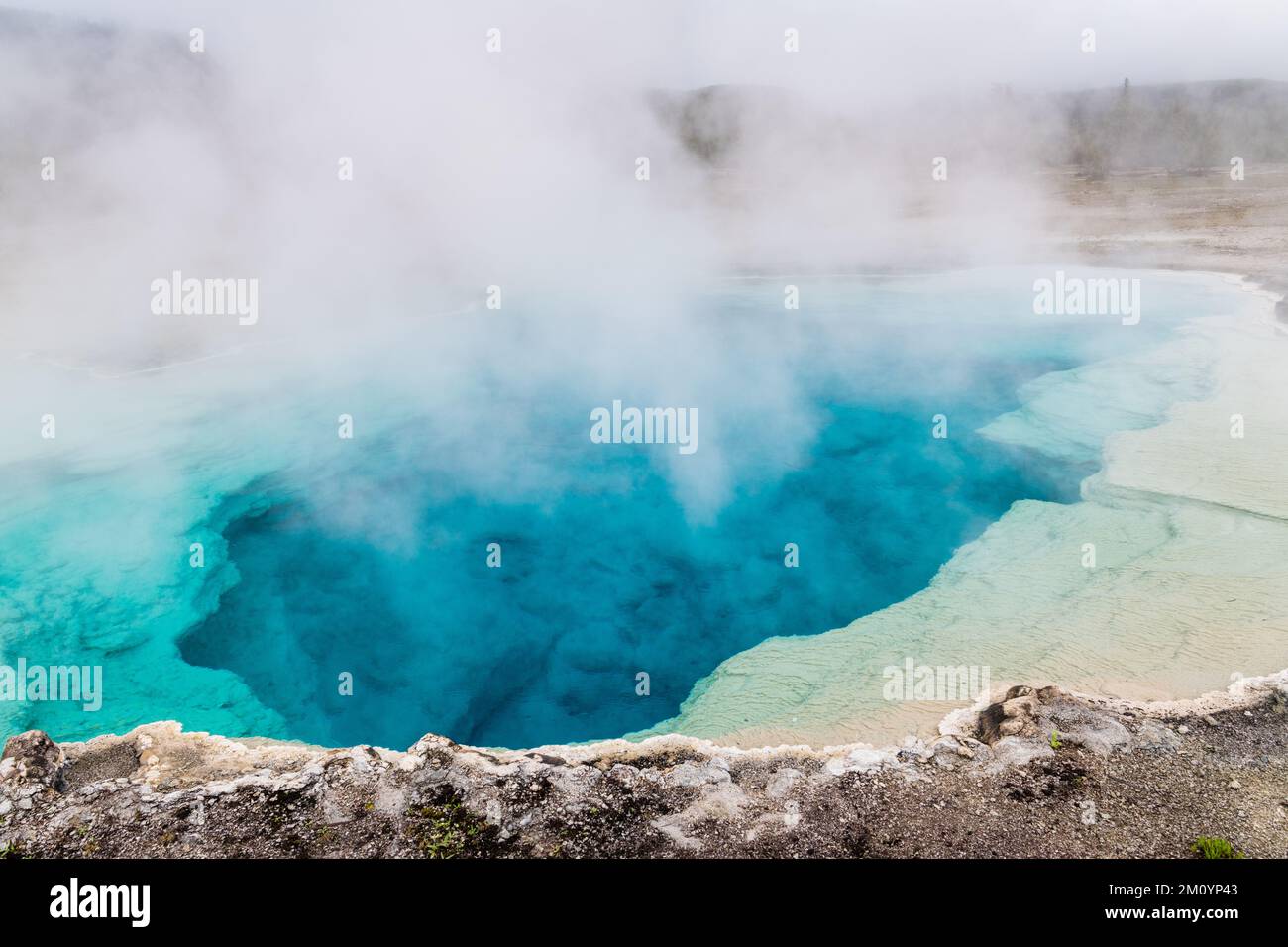 Beautiful clear, blue pool and steam from a hot spring at Excelsior ...