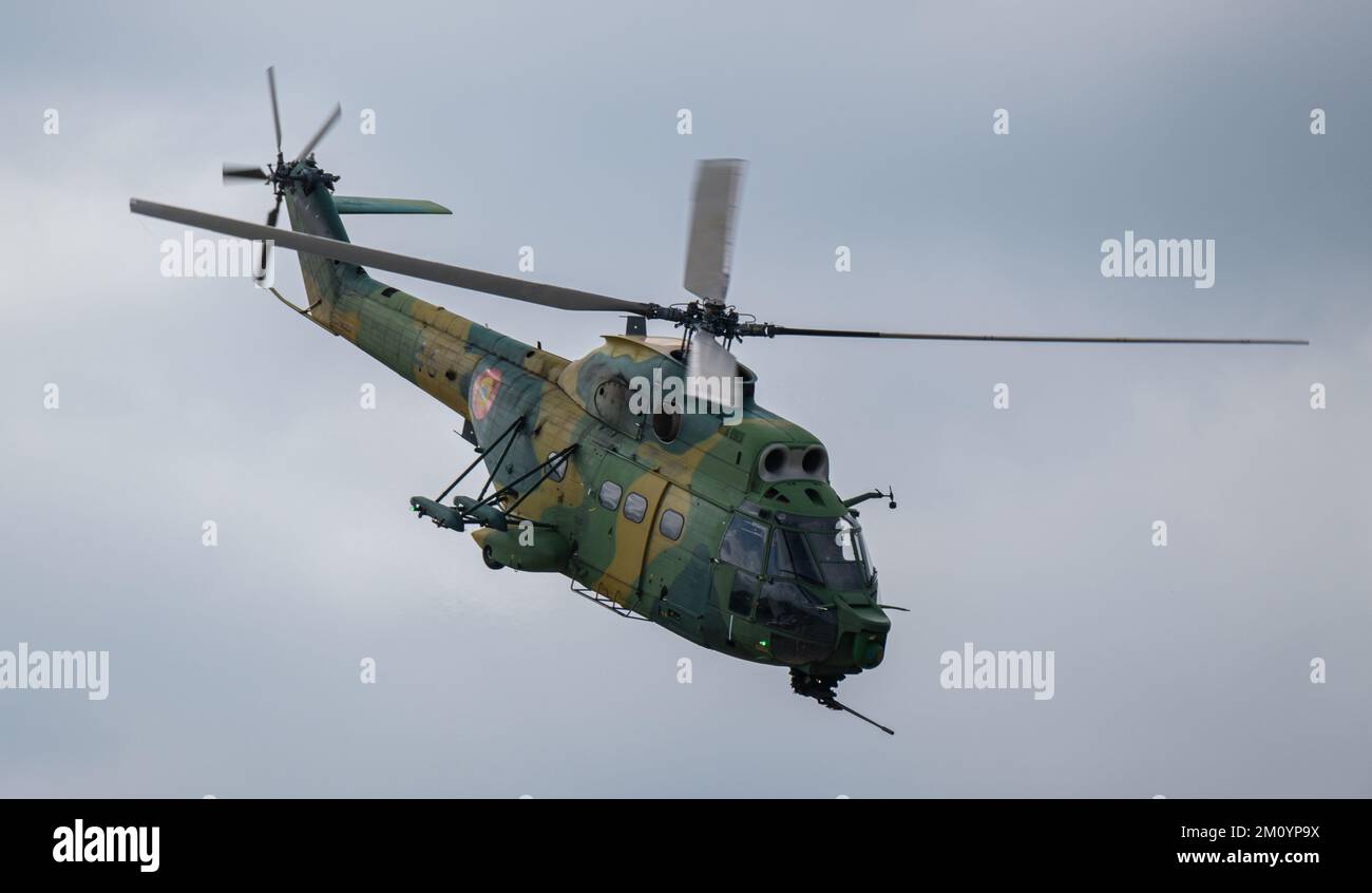 A helicopter flying in sky Stock Photo - Alamy