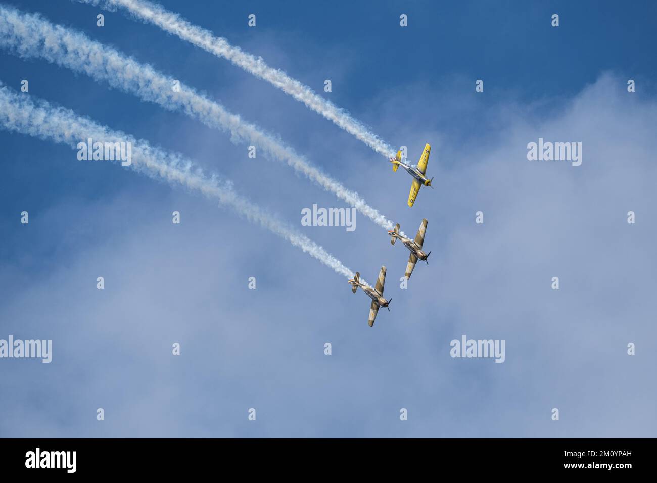 A view of airplanes flying in sky during airshow Stock Photo - Alamy