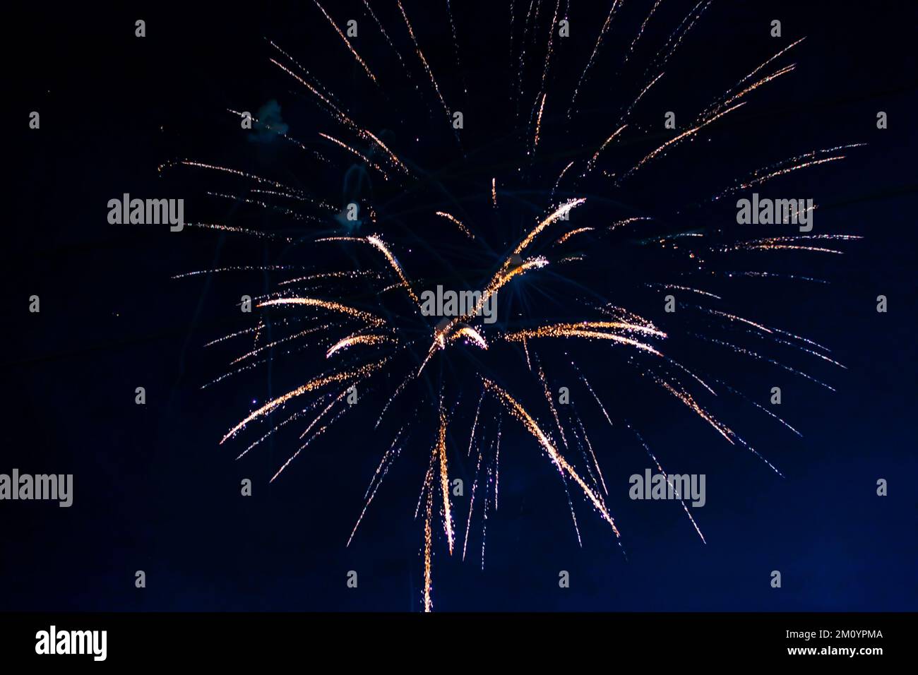 An explosion of bright single fireworks, against the background of the ...