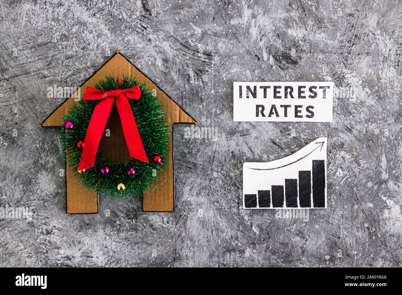Interest Rates text and graph with stats going up next to cardboard ...
