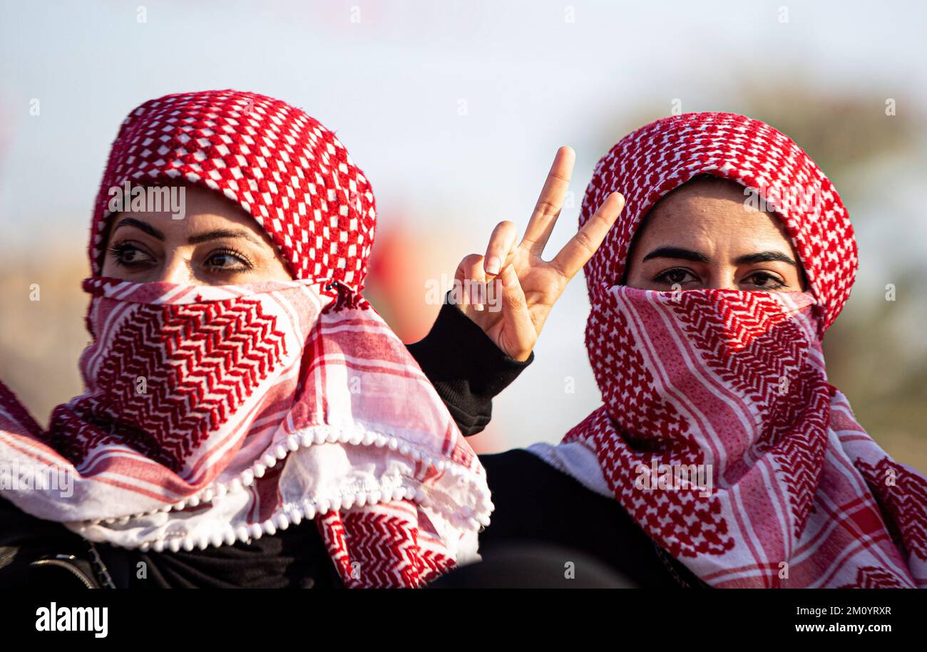 Gaza, Palestine. 08th Dec, 2022. A woman wearing a red keffiyeh ...