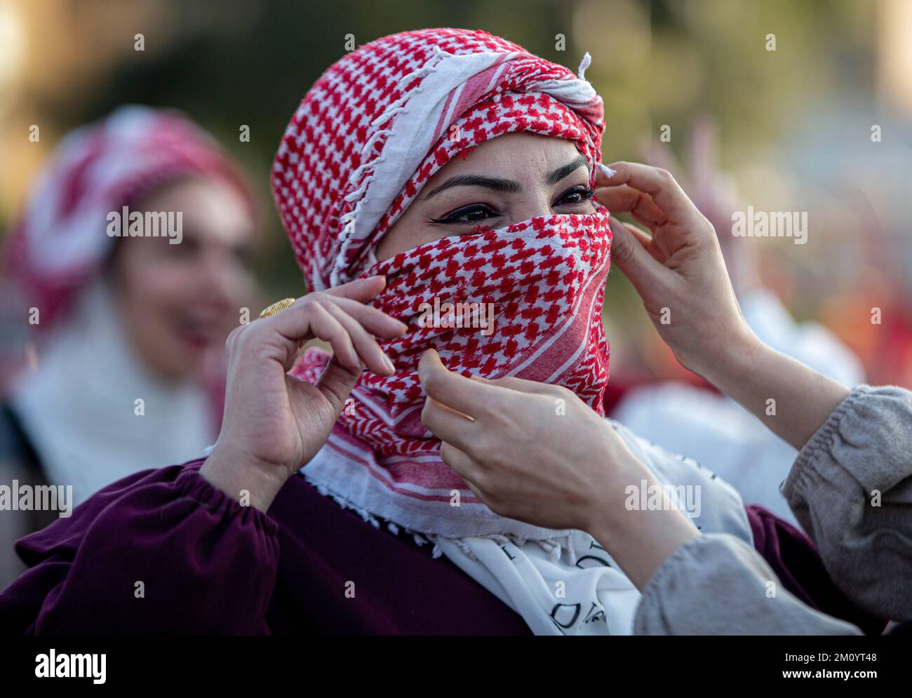 A supporter of the Popular Front for the Liberation of Palestine, wears ...