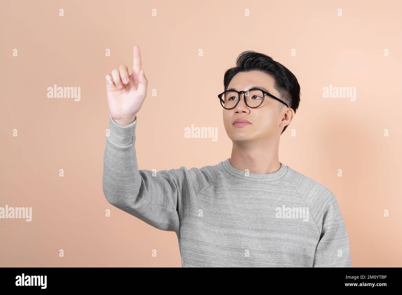 Asian man with the camera facing the palm, touching an interactive ...