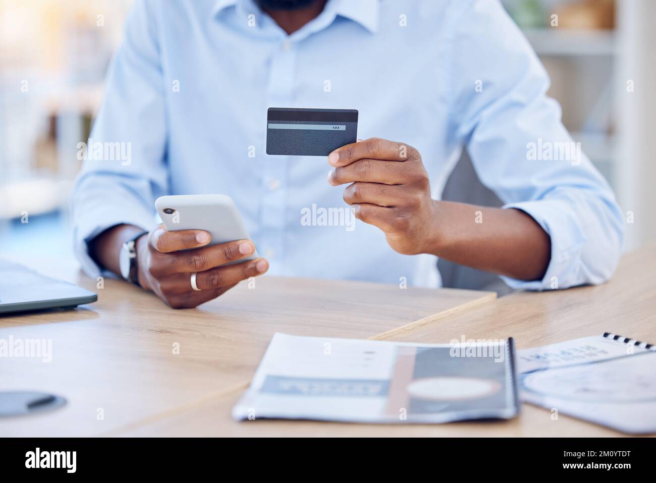 I can pay bills quickly. an unrecognizable businessperson using a phone ...
