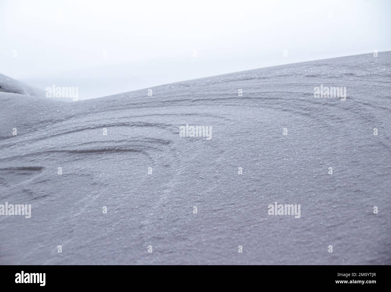 Close up winter view of a natural snow drift texture background, with ...