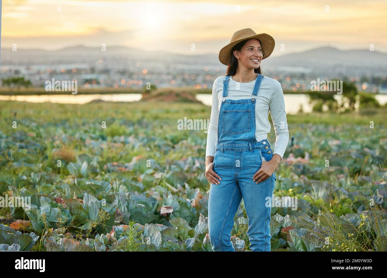 Plants are such interesting organisms to study. a young farmer standing ...