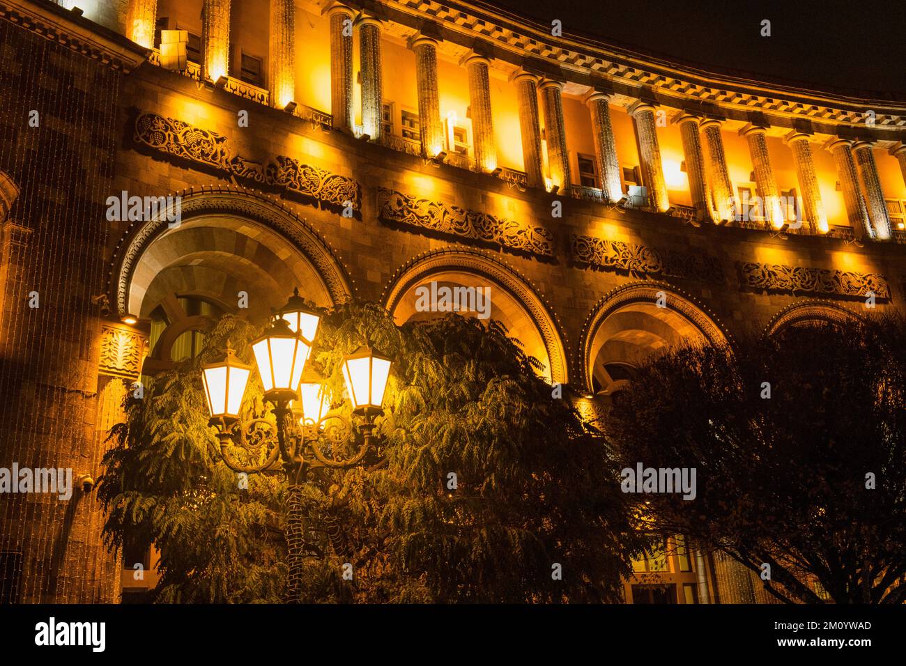 Lamp post with multiple lanterns next to the government building in ...